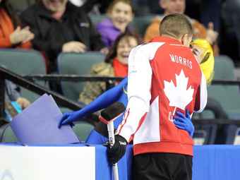 Gallery: Fan gets a kiss at the Brier | Calgary Herald