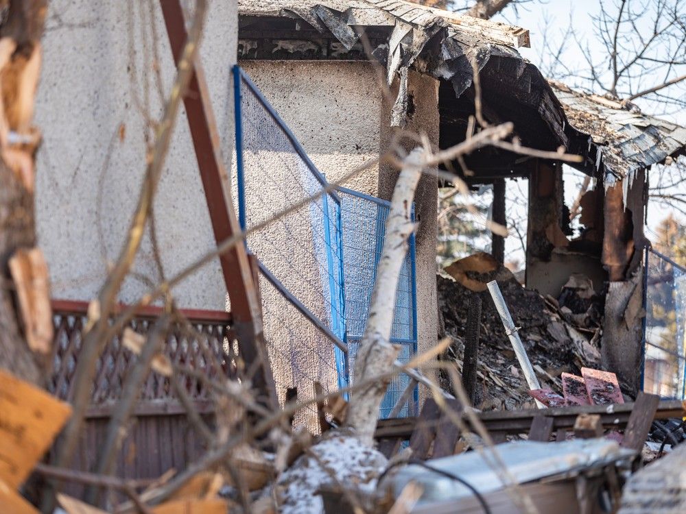 Photos: Debris, shattered windows on display two days after Calgary ...
