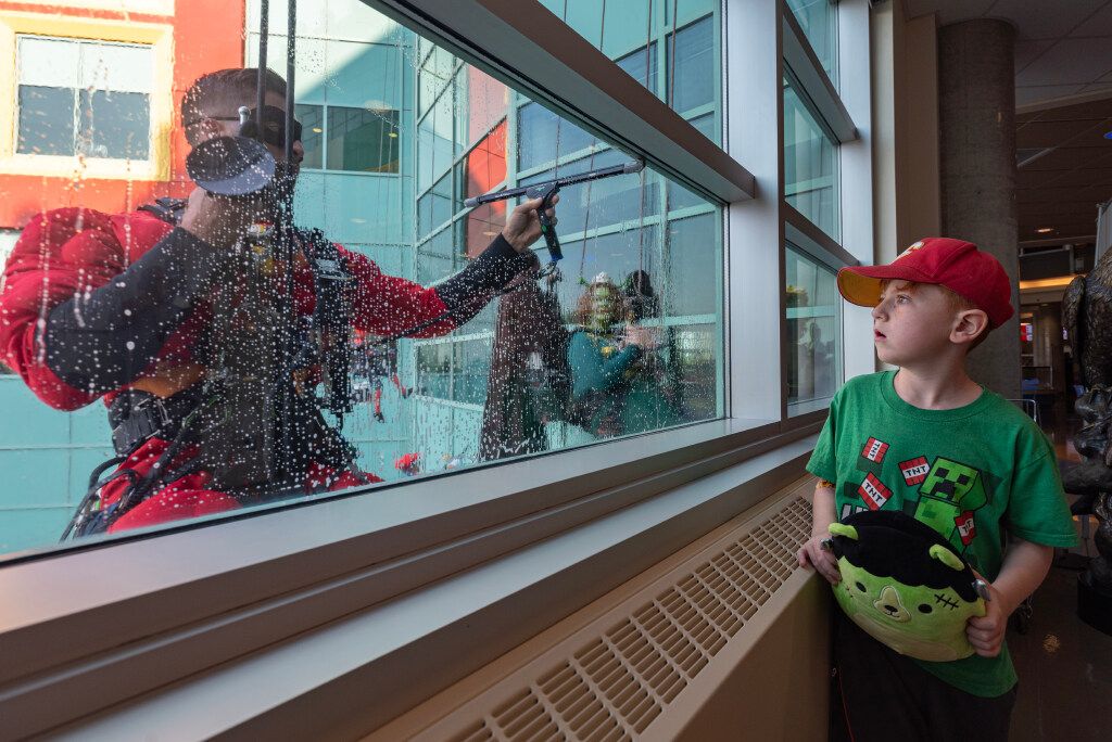 Superhero Grime Fighters wash windows at Alberta Children's Hospital ...