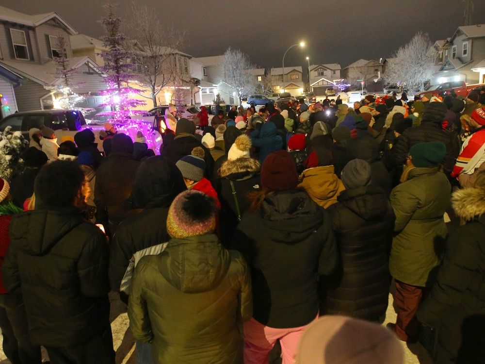 Dozens brave cold in vigil for slain Calgary mother and her father ...