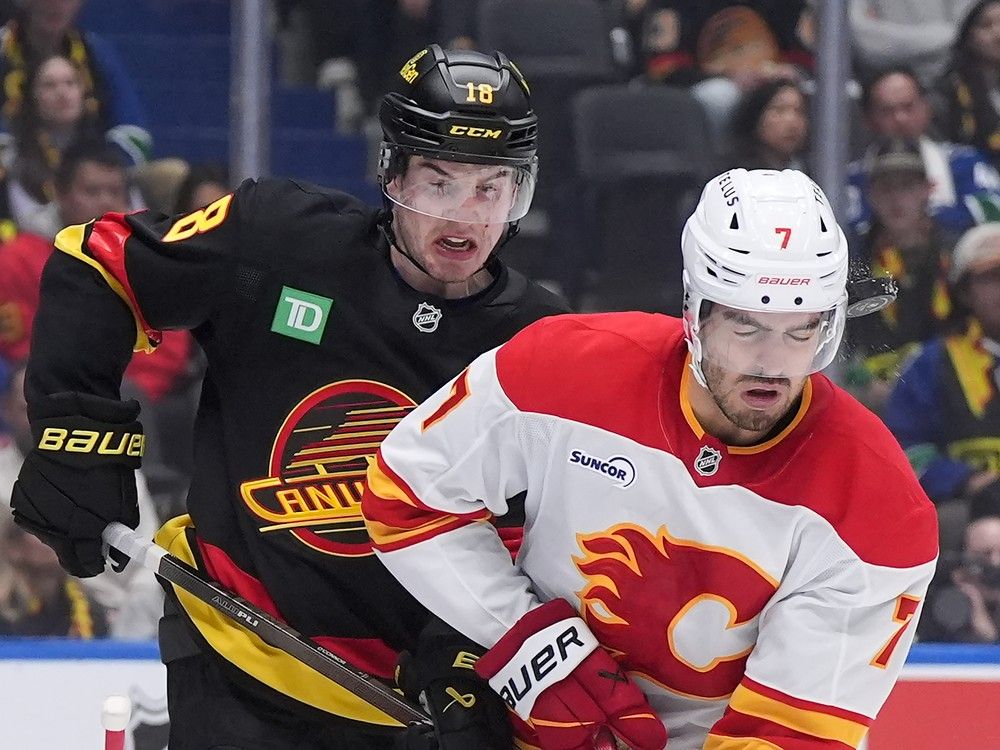Three takeaways as Kevin Bahl leaves during Flames' loss to Canucks ...