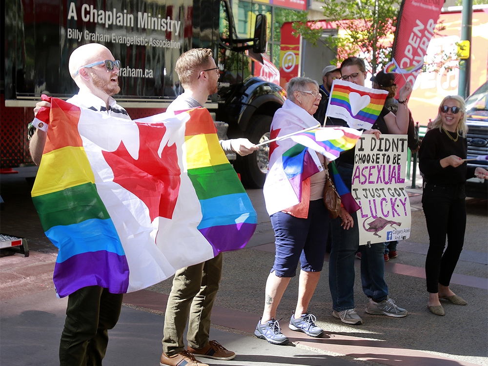 LGBTQ group protests Billy Graham Association truck parked near Pride ...