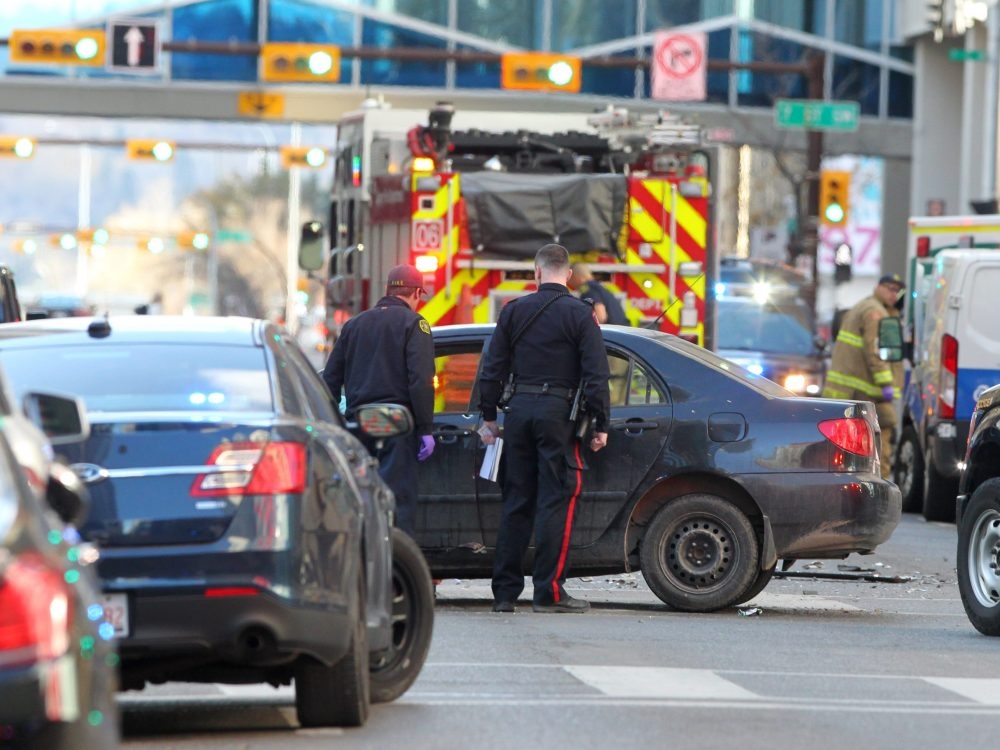 Calgary cop fired three shots at vehicle that nearly drove into parade ...