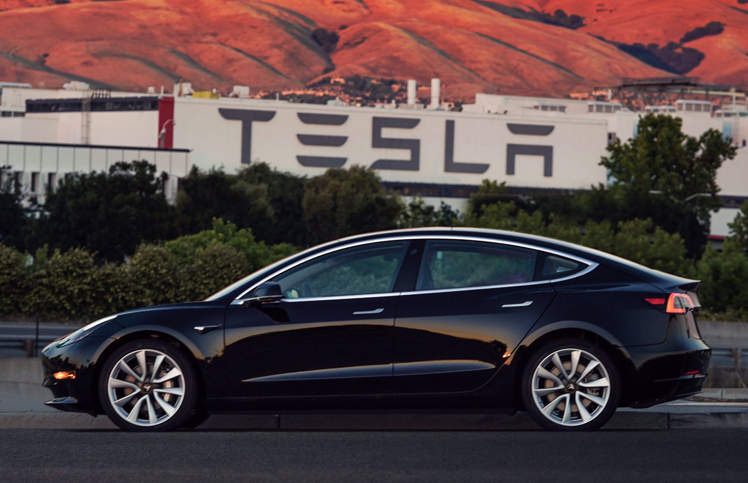 Tesla unveils its first production-spec Model 3 sedan | Driving