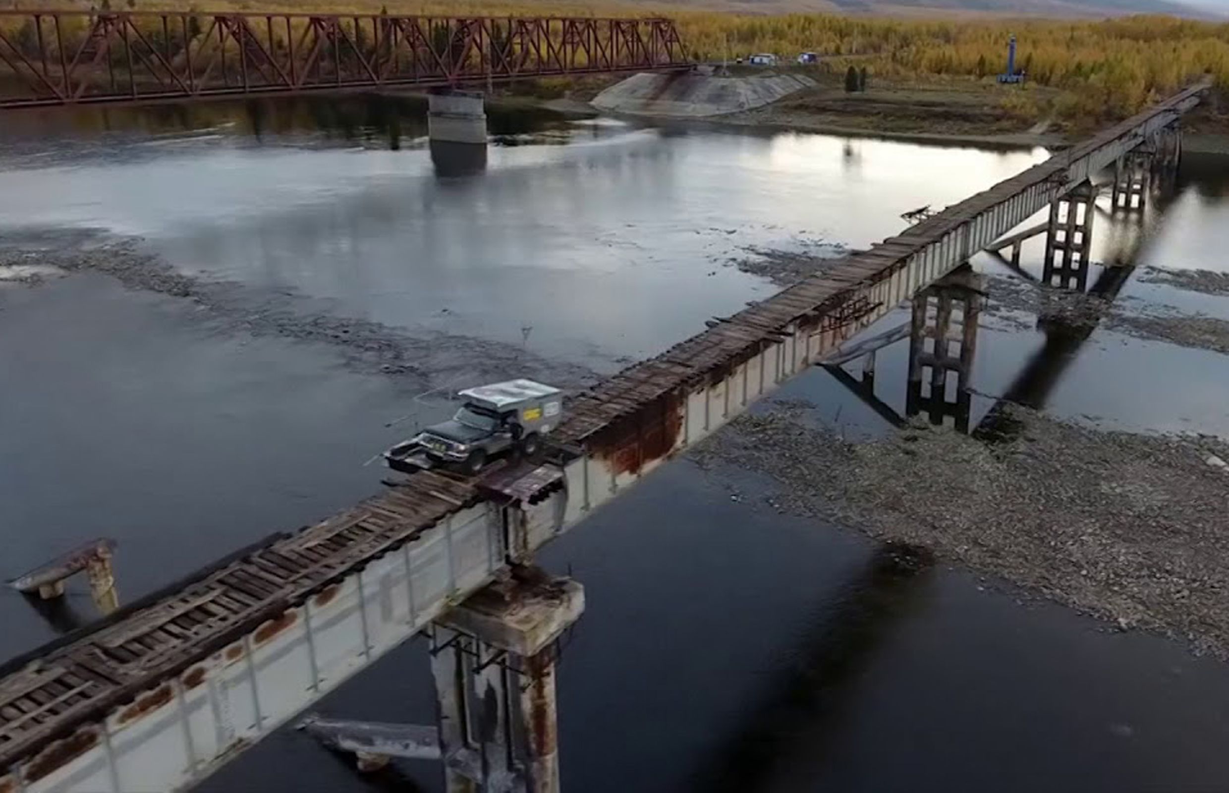 Watching an SUV cross this narrow, no-guardrail bridge is nerve ...