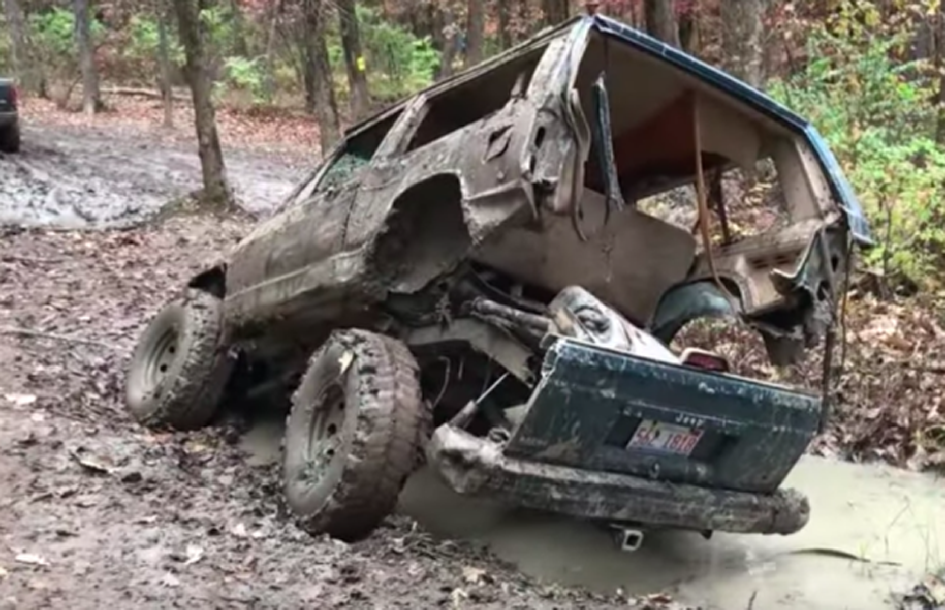 Jeep Cherokee XJ literally folds itself in half in mud hole | Driving