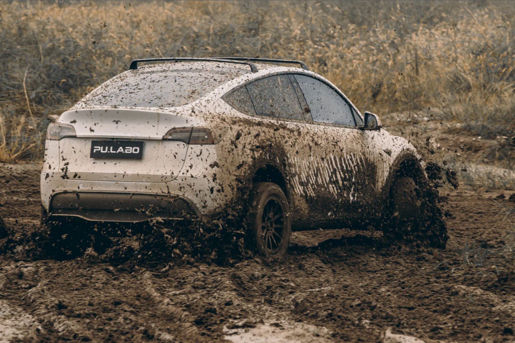 Wild Tesla Model Y lift kit shows off some smart engineering | Driving