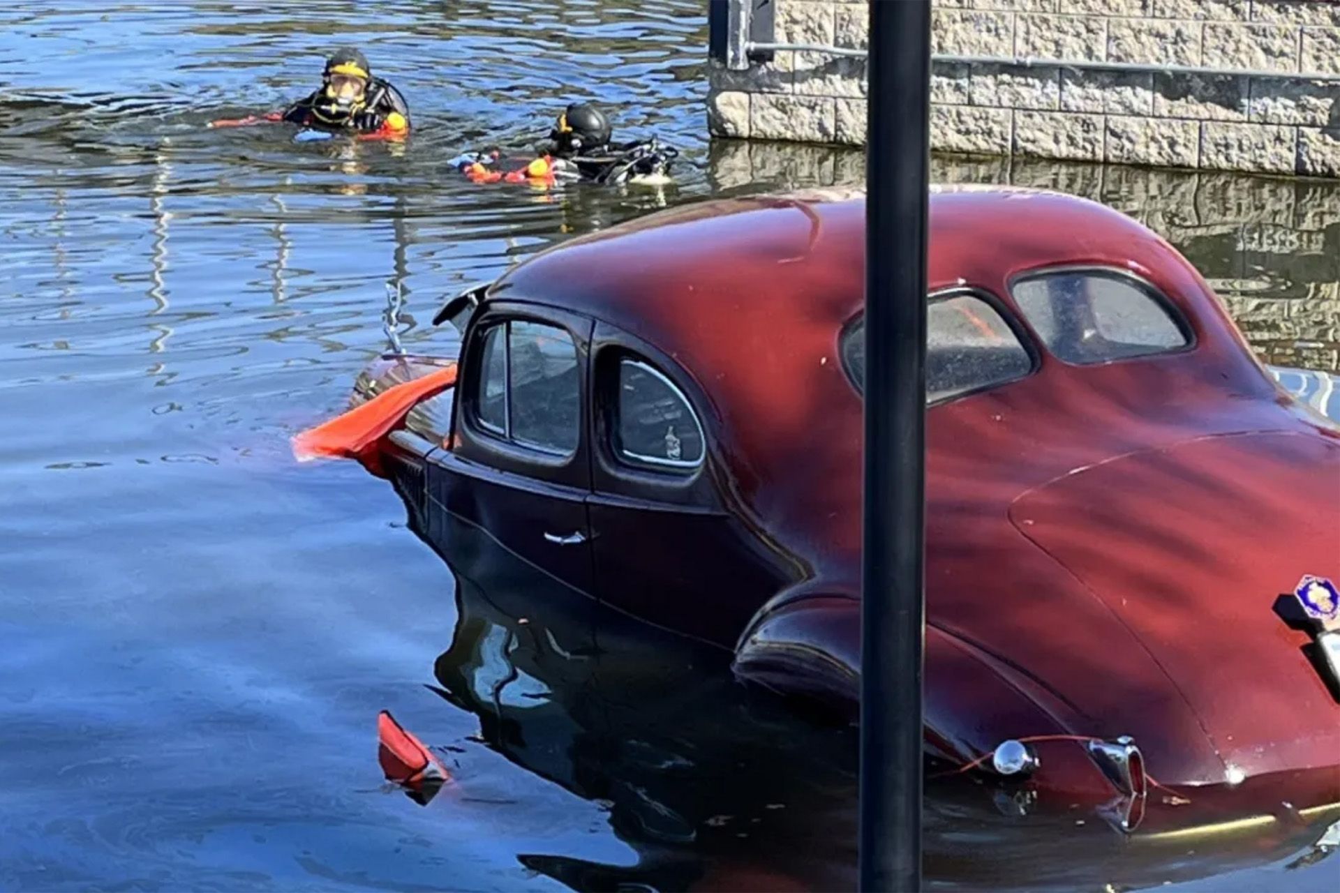 Classic Packard rolls into lake during owner's photo shoot | Driving