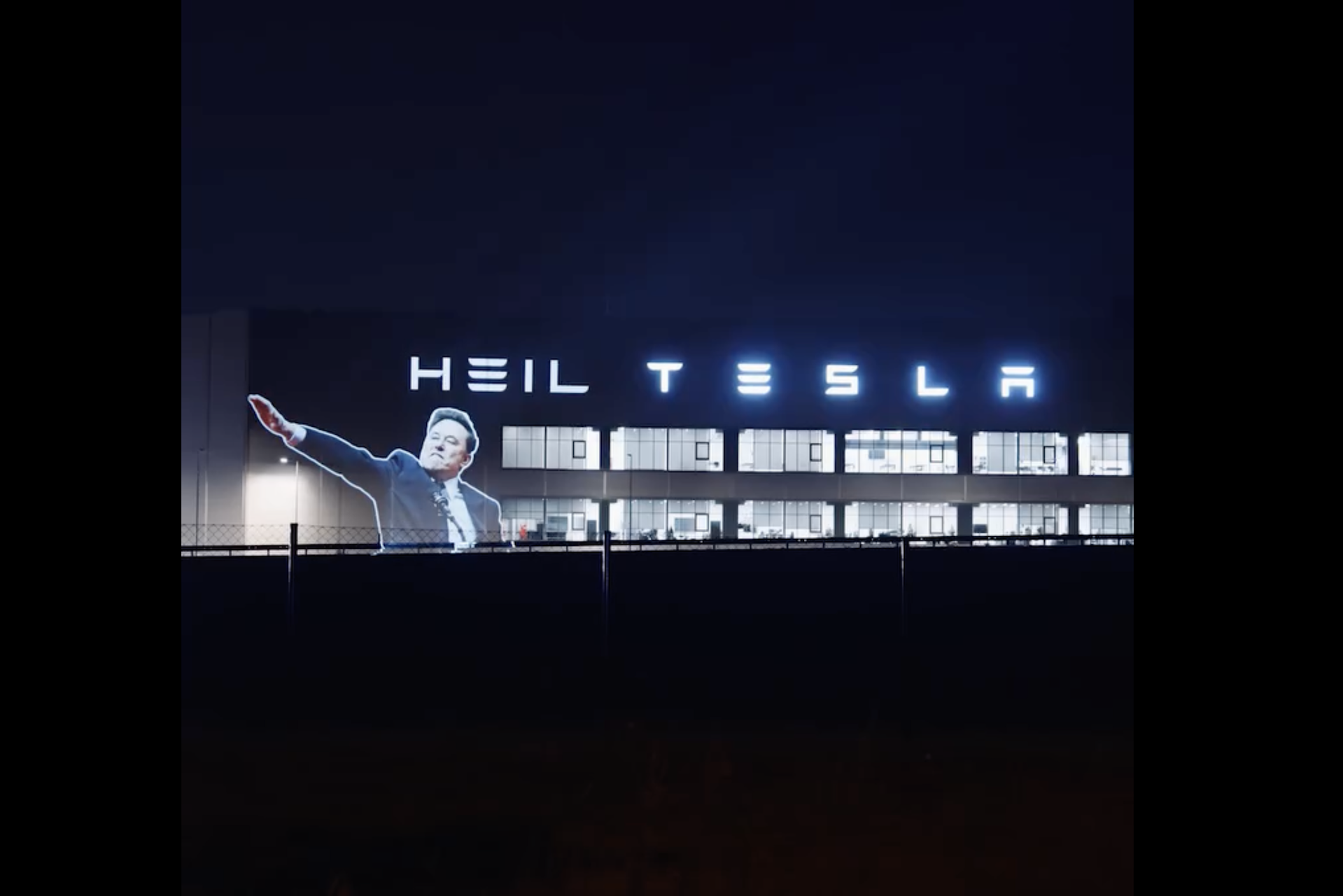 Protest group projects Musk gesture onto German Tesla factory | Driving