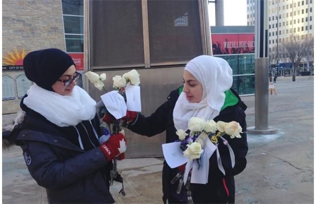Grassroots Muslim group hands out white roses in downtown Edmonton as a ...