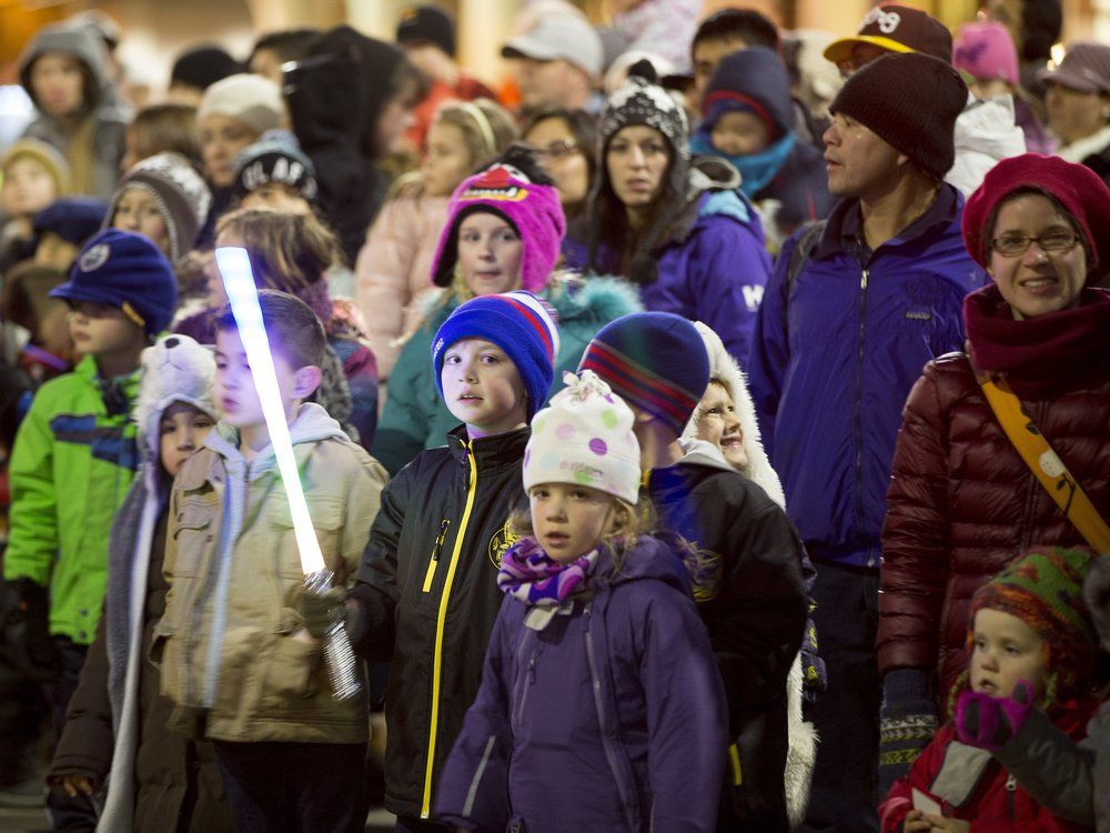 Edmonton's first outdoor Santa parade in decades draws crowds downtown ...