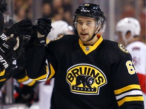 Edmonton Oilers' Milan Lucic outside the penalty box, but looking in ...