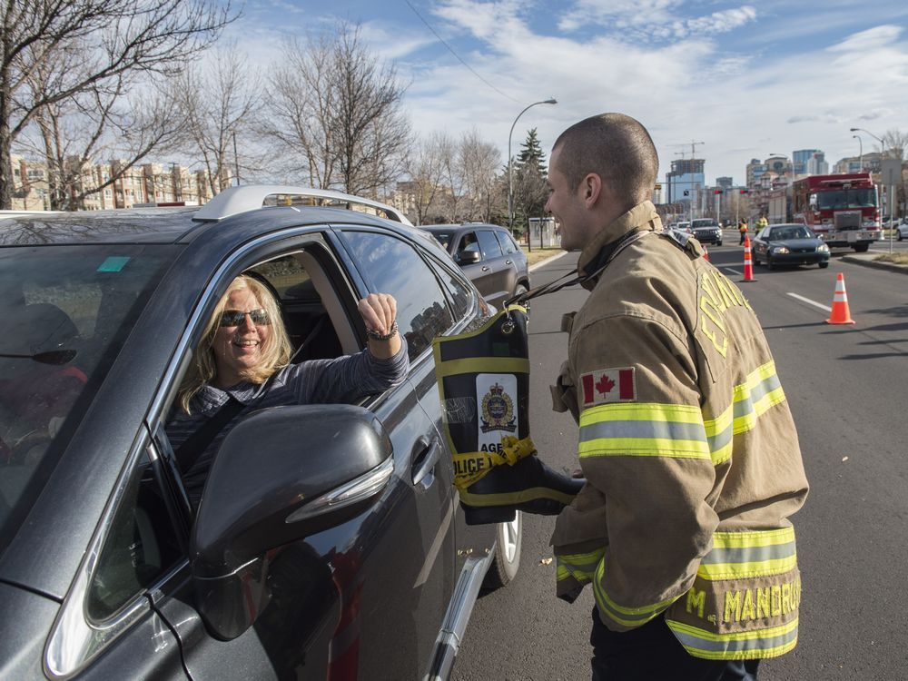 Firefighters holding boot drive in support of Muscular Dystrophy ...