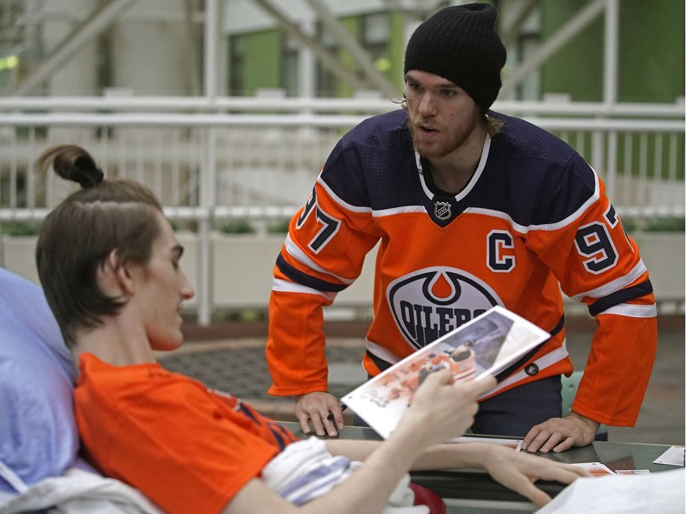 Scoring smiles: Oilers bring holiday joy to children at the Stollery ...