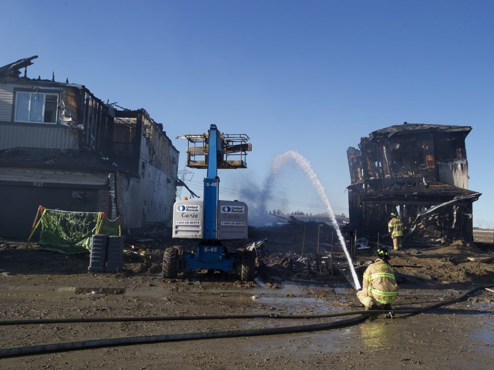 Neighbours evacuated after fire at two homes under construction in ...