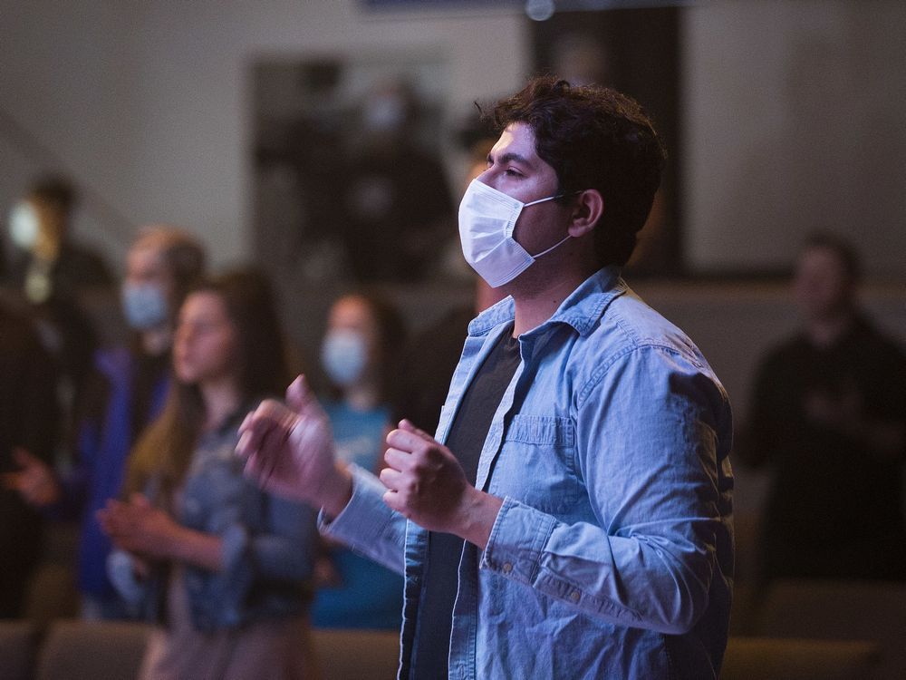 Face shields can't cover smiles as congregation gathers for Sunday ...