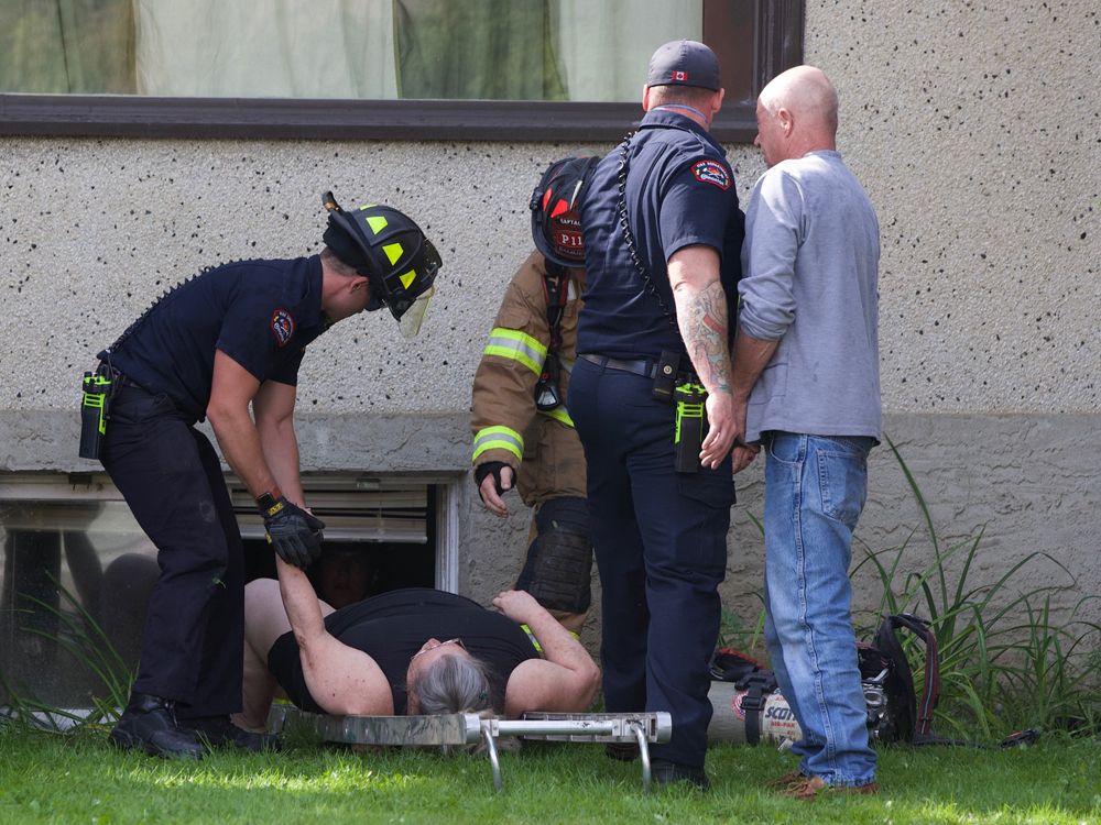 Firefighters rescue two from basement after garage fire spreads to home ...