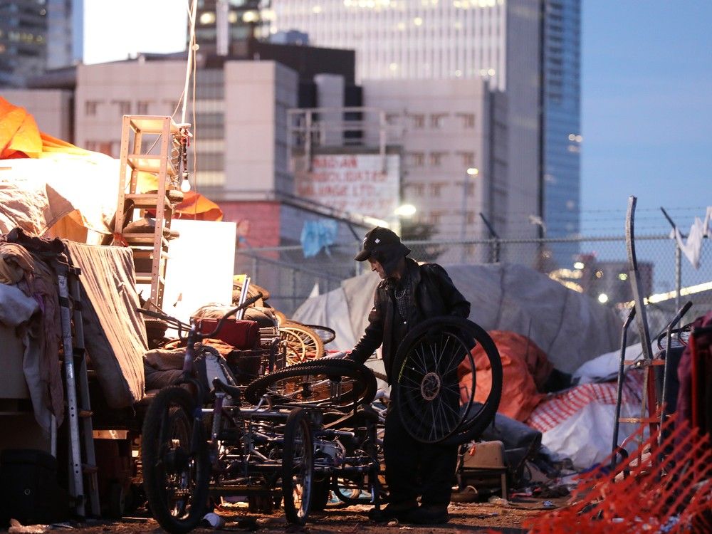 Photos: City of Edmonton, EPS crews clear homeless encampment ...
