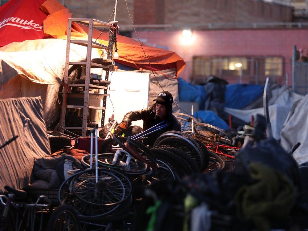 Photos: City of Edmonton, EPS crews clear homeless encampment ...