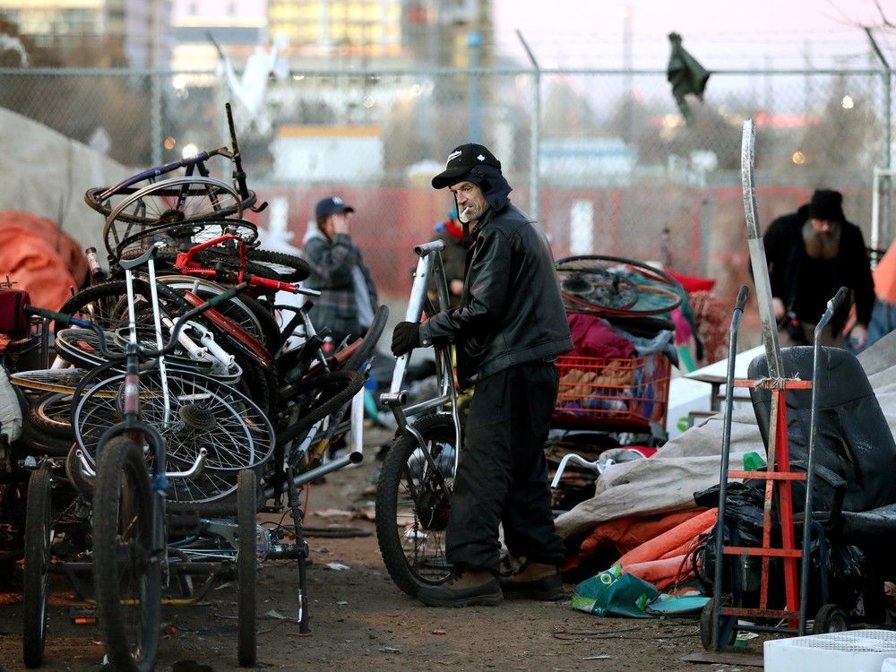 Photos: City of Edmonton, EPS crews clear homeless encampment ...