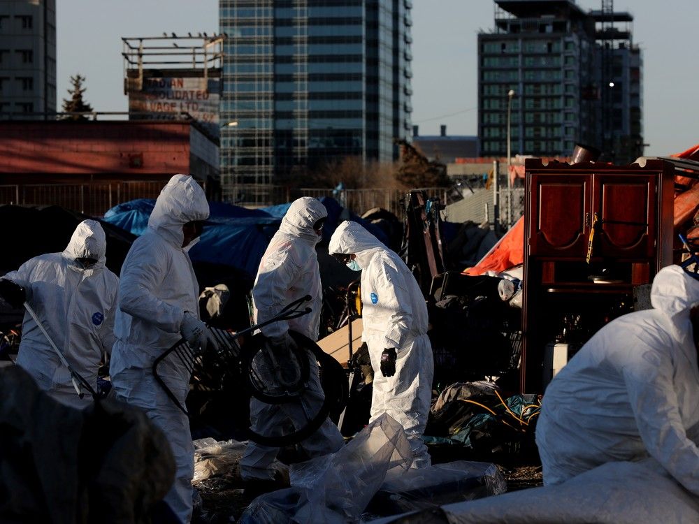 Photos: City of Edmonton, EPS crews clear homeless encampment ...