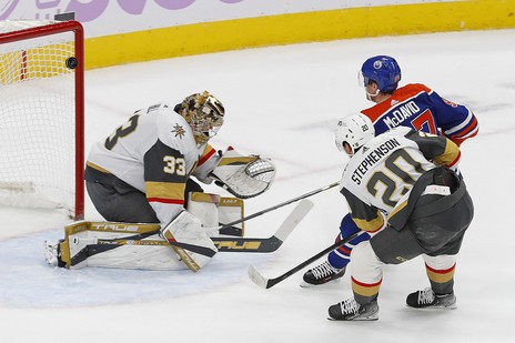 Oilers give up three late draft picks in trade for goaltender Cam ...