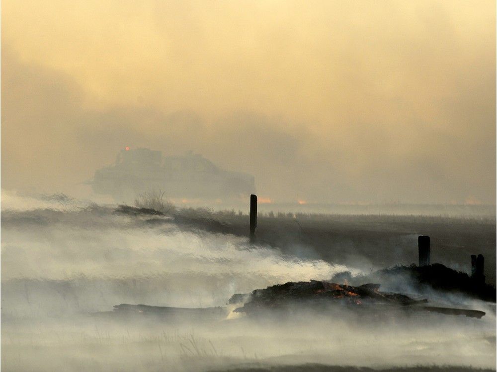 Gallery: Firefighters battle grass fire outside Regina Wednesday ...