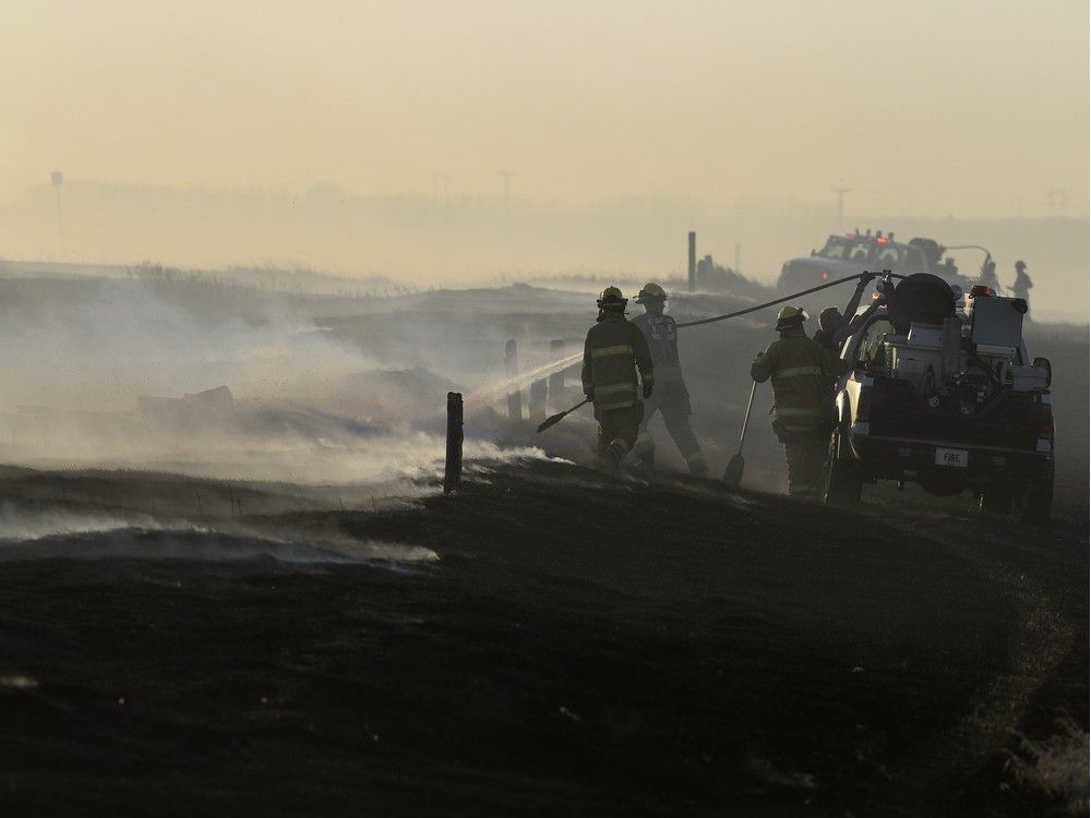 Gallery: Firefighters battle grass fire outside Regina Wednesday ...