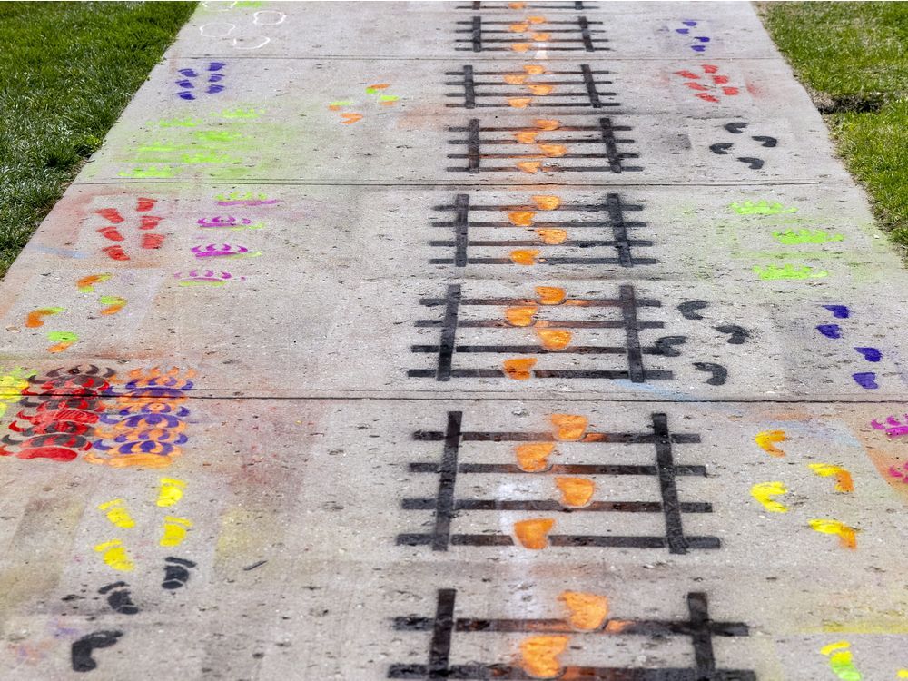 Painted footsteps commemorate unmarked graves at residential schools ...