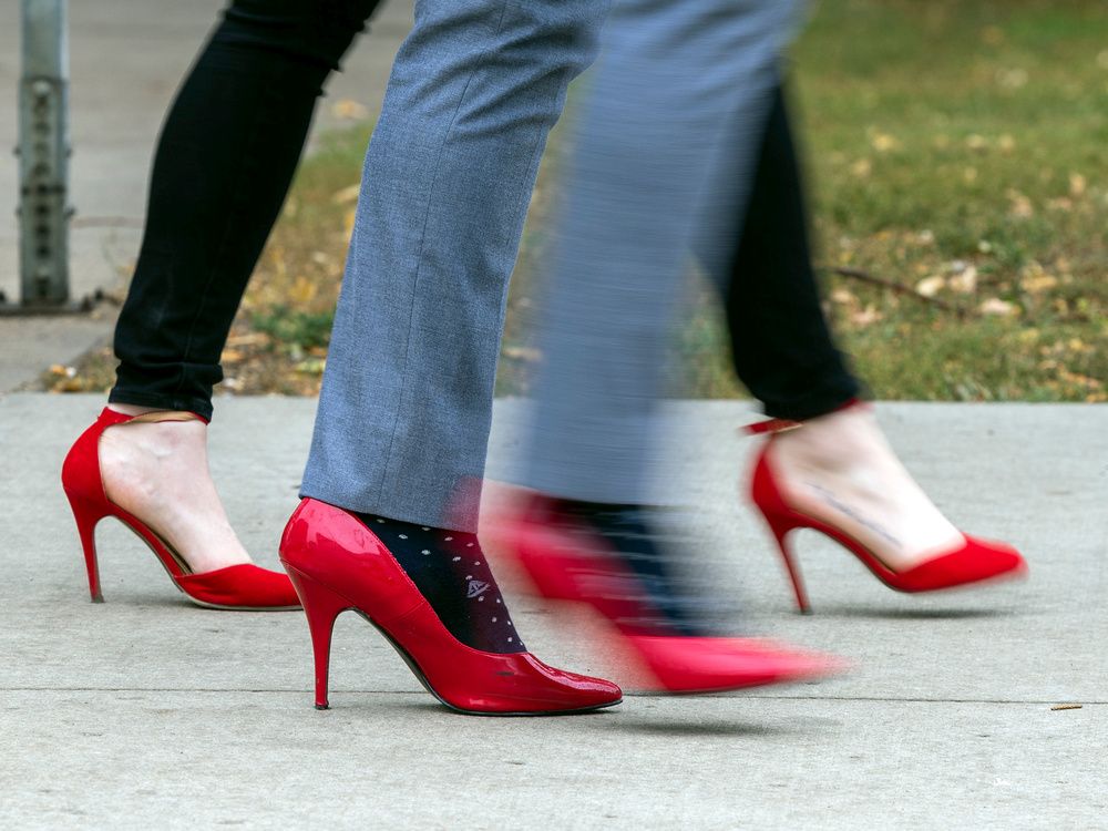 Reginans step into red heels for YWCA's Walk A Mile in Their Shoes ...