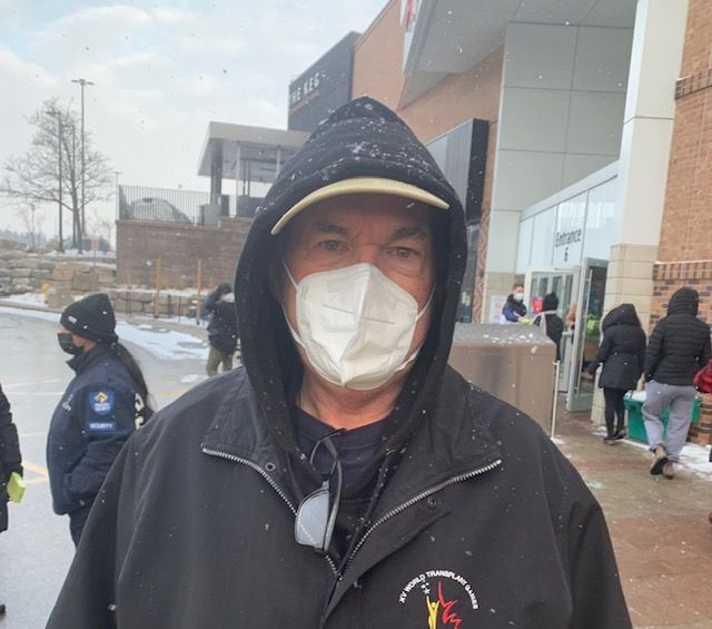 In massive line for free COVID rapid tests, latest shutdown weighs ...