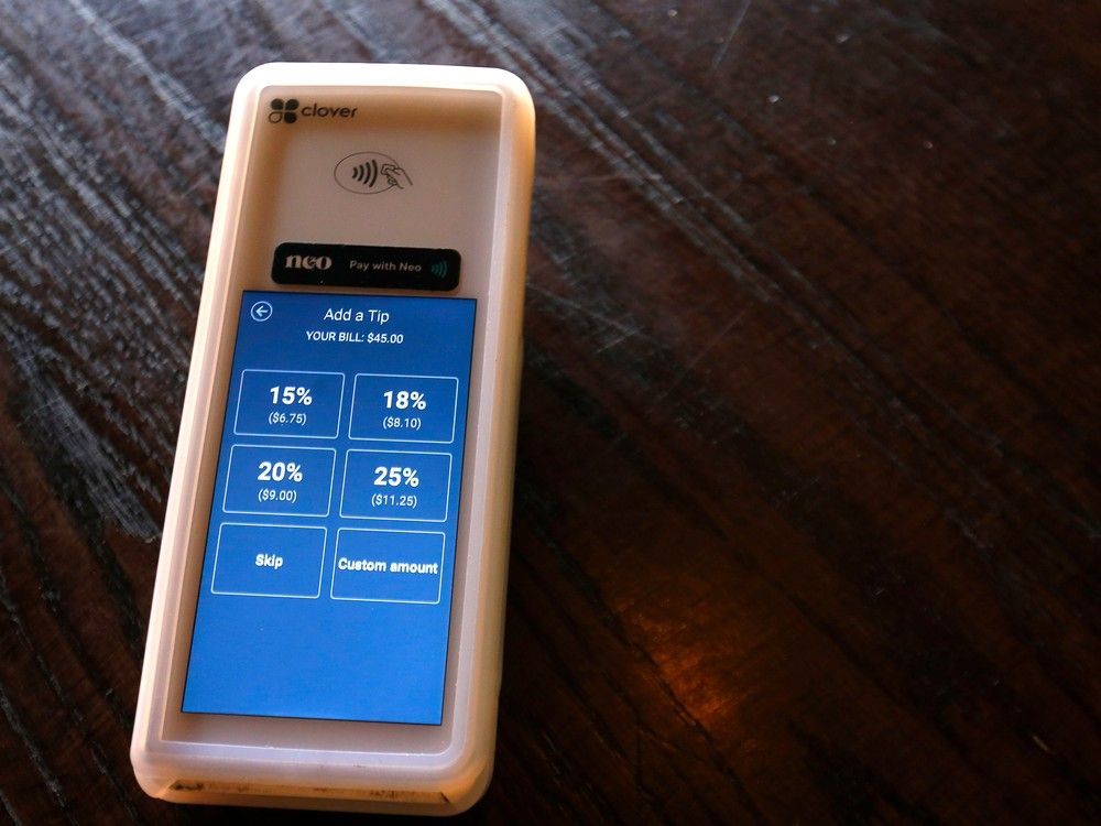 Most Canadians tip more because payment machines prompt it: poll ...