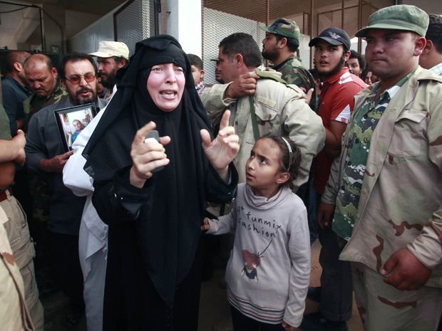 Muammar Gaddafi's corpse taken off display, but fallen dictator remains ...