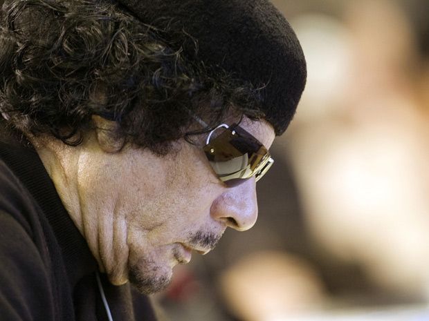 Muammar Gaddafi buried: Gaddafi and son Mo'tassim were buried at dawn ...
