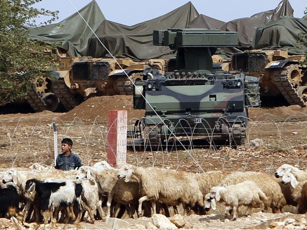 Syrian mortars again land in Turkey as warnings of war ignored ...