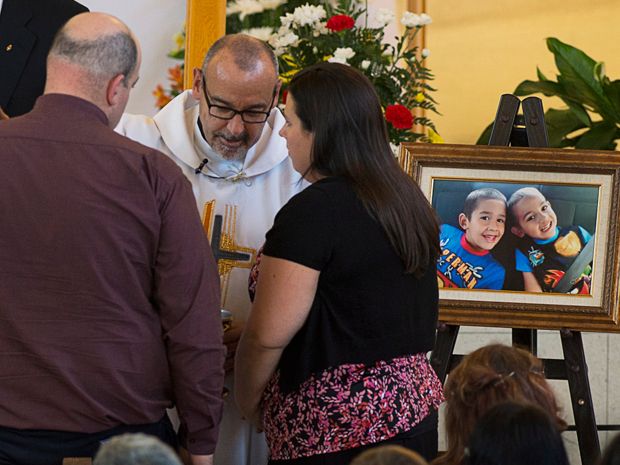 Hundreds attend funeral for two brothers killed by python | National Post