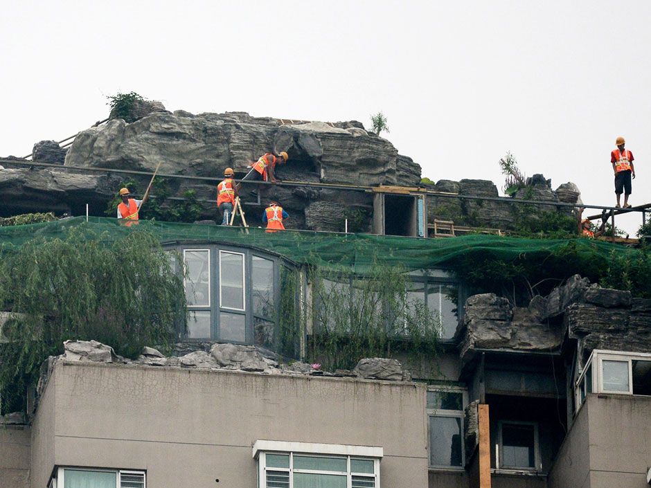 Massive, faux mountain retreat atop Chinese high-rise demolished after ...