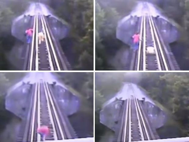 Two women caught on train track bridge are run over by freight train ...