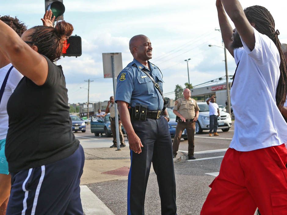Highway Patrol captain marches with Ferguson protesters as peace ...