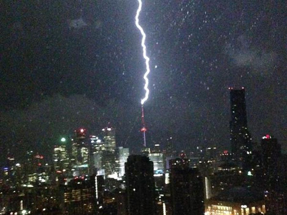 Toronto storm floods streets and shuts down trains as lightning licks ...