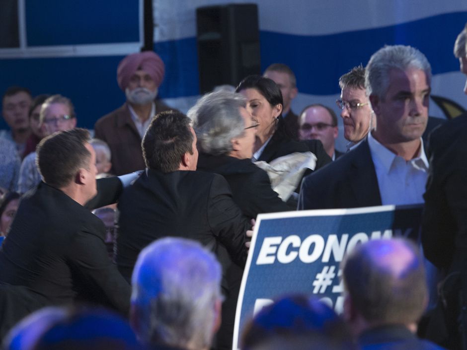 Protester charges at Stephen Harper during turbulent B.C. campaign ...