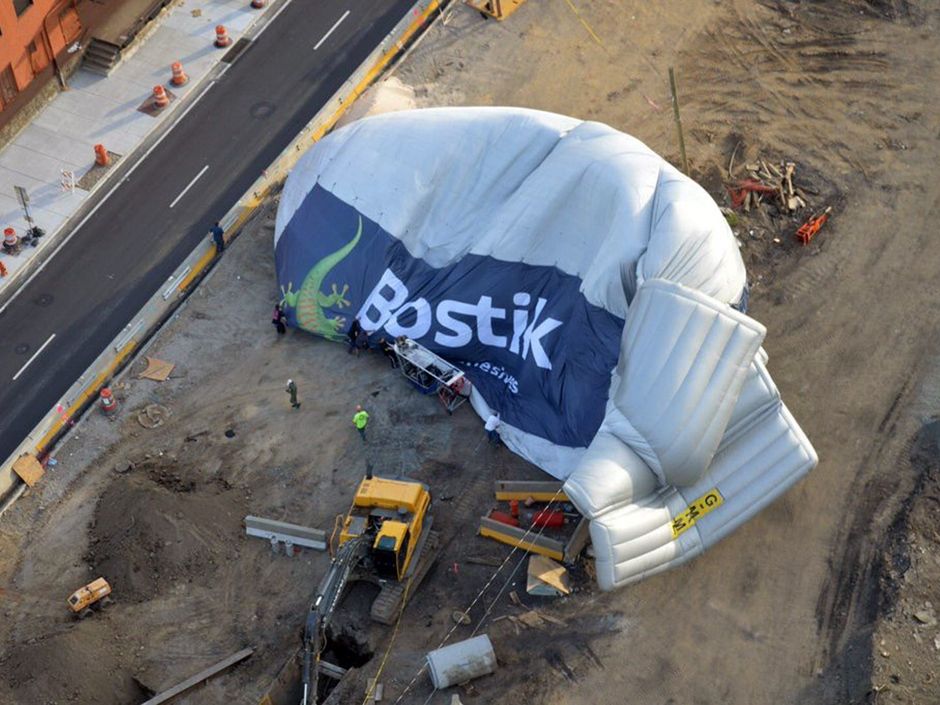 Blimp makes emergency crash landing at construction site next to ...