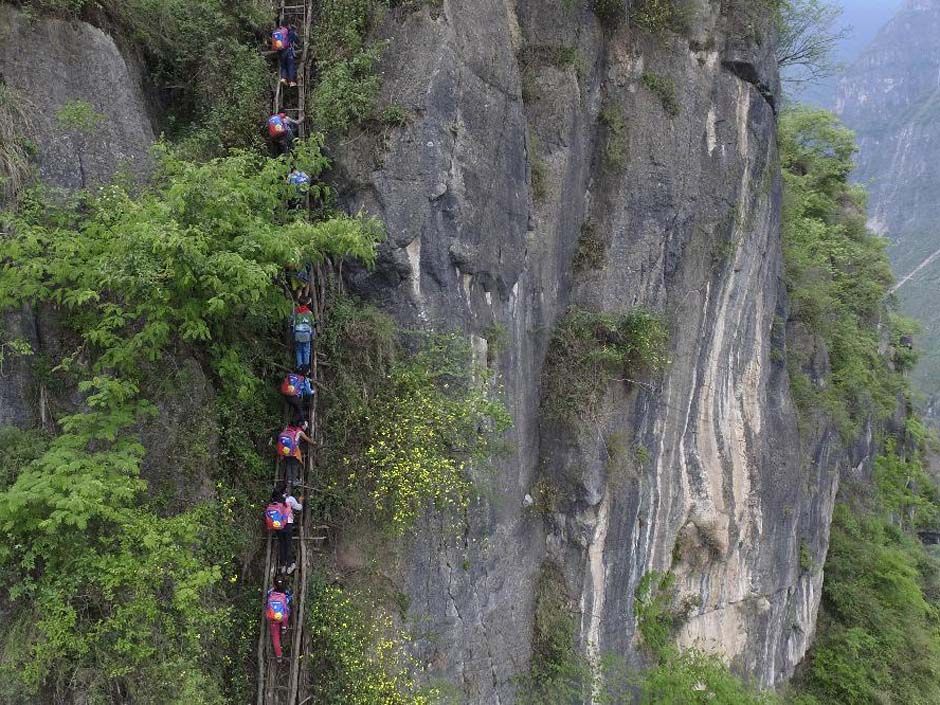 After alarming photos of children scaling 800-metre ladder appear ...