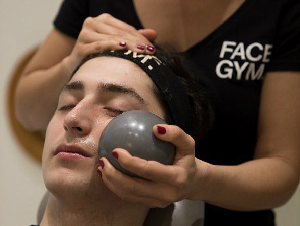 There's a gym for your face where 'trainers' slap and knead your skin ...