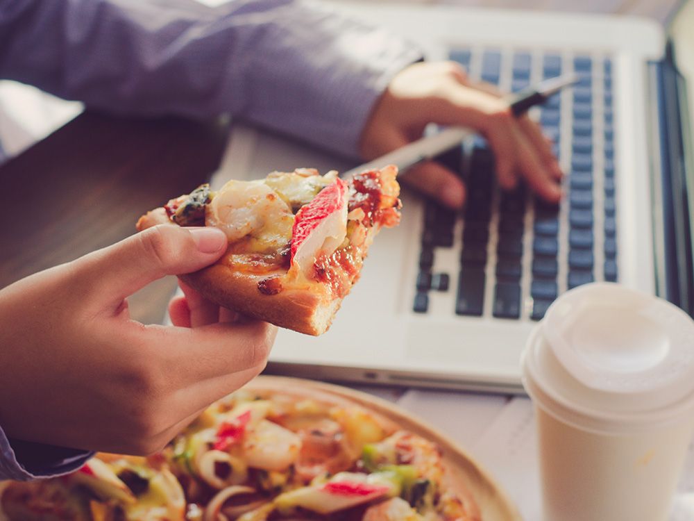 Dining 'al desko': How workplace snacking adds up to thousands of empty ...