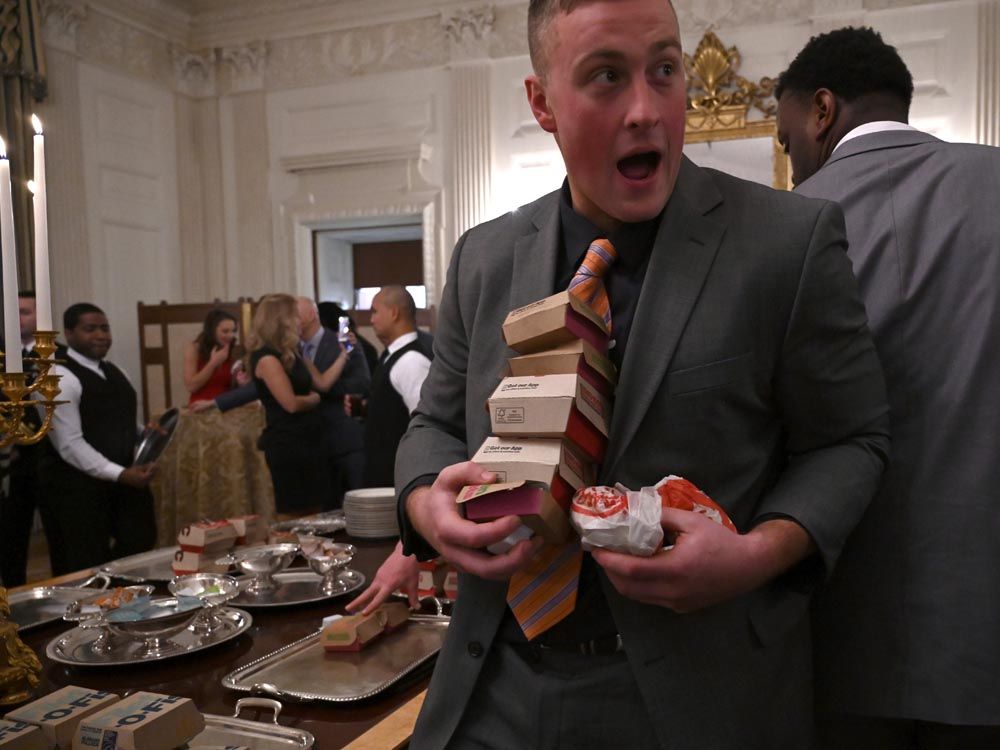 Photos: The strange juxtaposition of Trump lording over fast food on ...