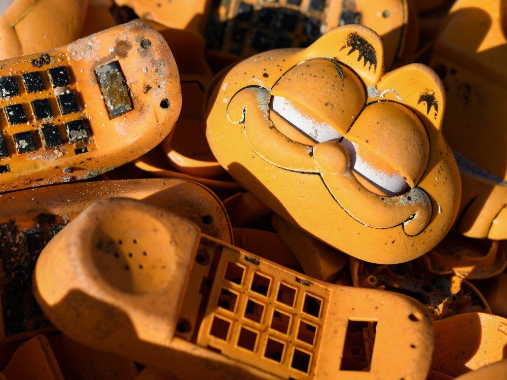 For 30 years, Garfield phones have been washing ashore in France. Now ...