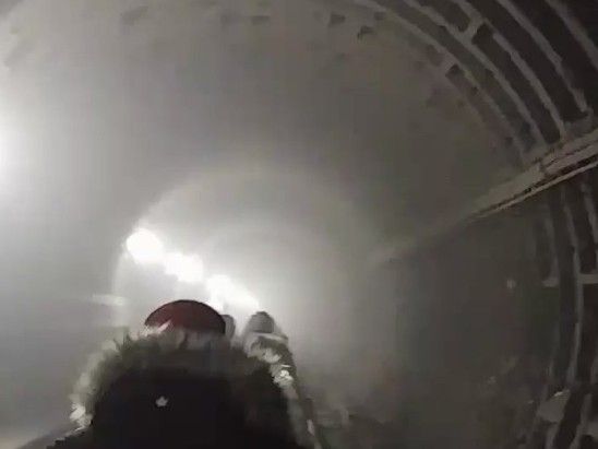 Commuters are forced to walk through smoky tunnel after fire shuts down ...