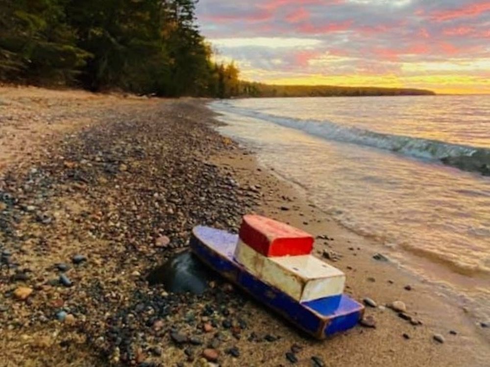 Wooden toy boat washes ashore on Lake Superior after 27 years adrift ...