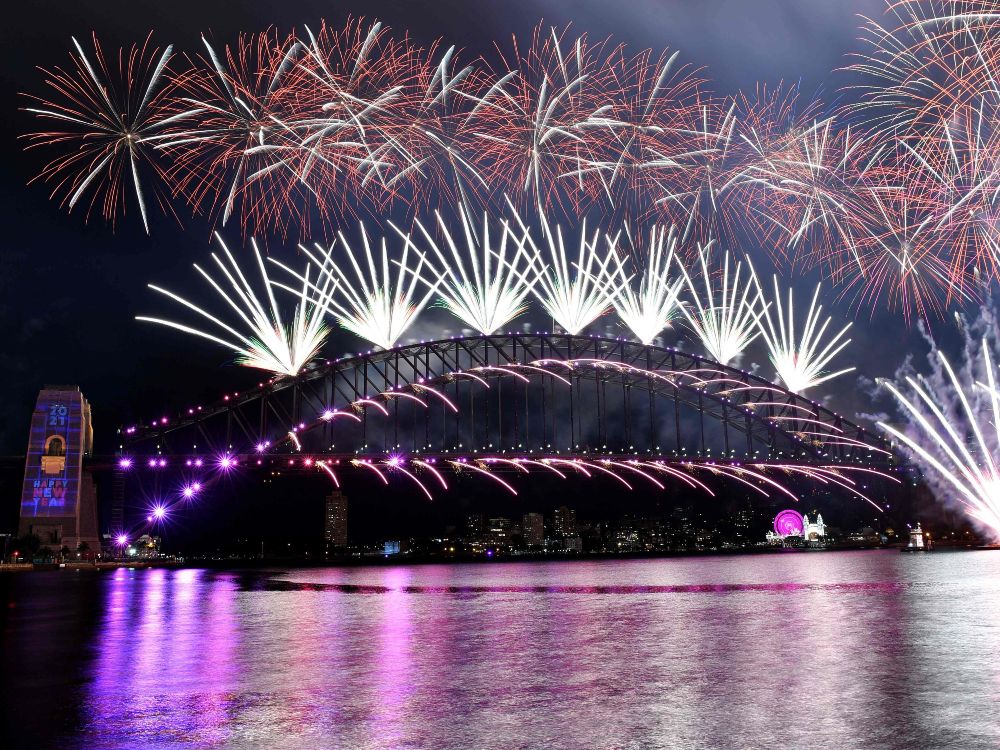 Fireworks explode over deserted ghost towns as 2020 slinks off into ...